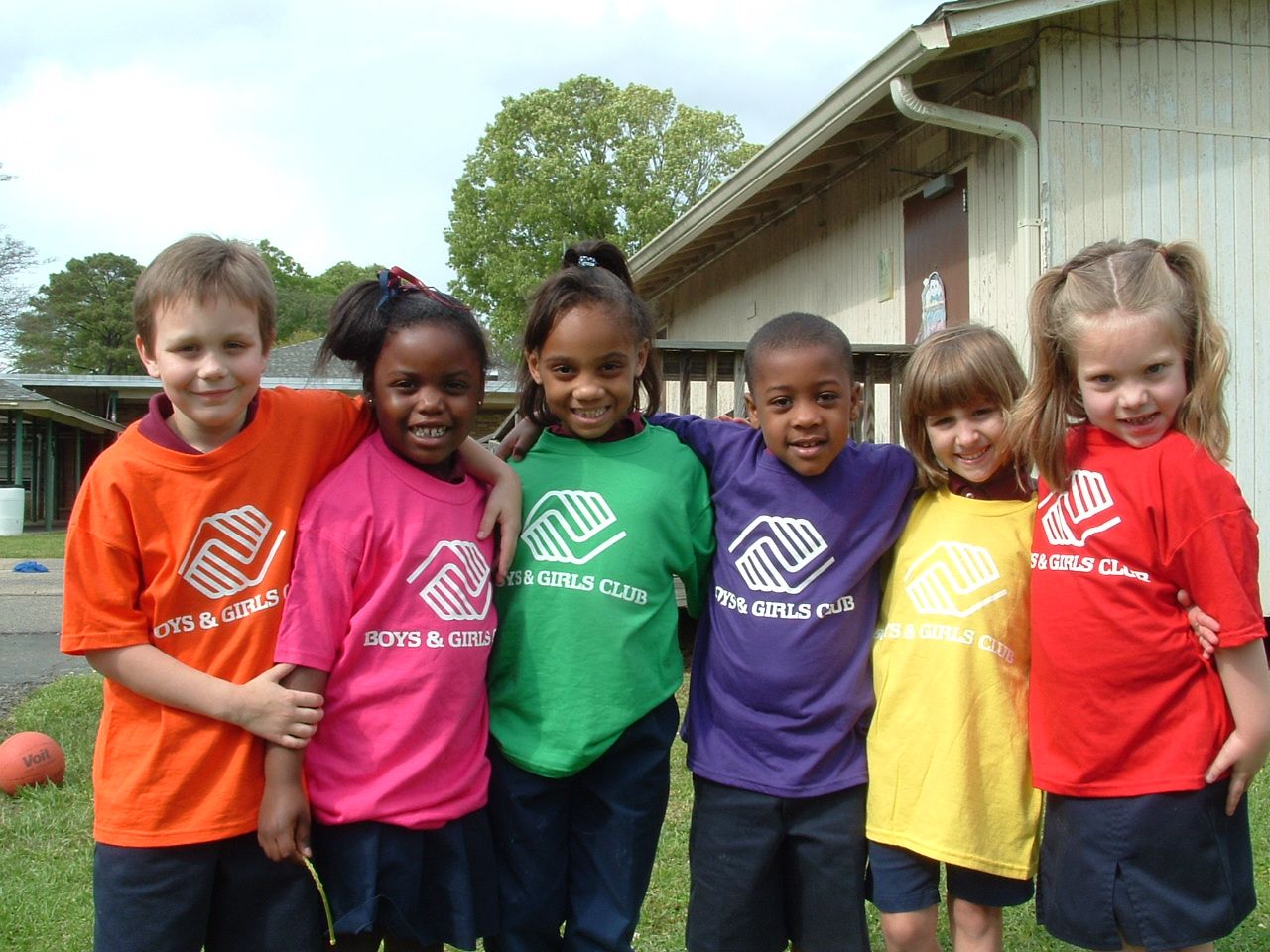 kids outside smiling with BGC shirts on - Boys & Girls Club of Kenosha